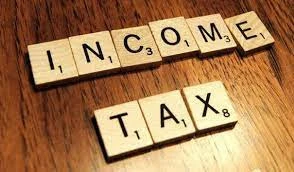 The Pros and Cons of Implementing a Flat Tax System - TheOmniBuzz